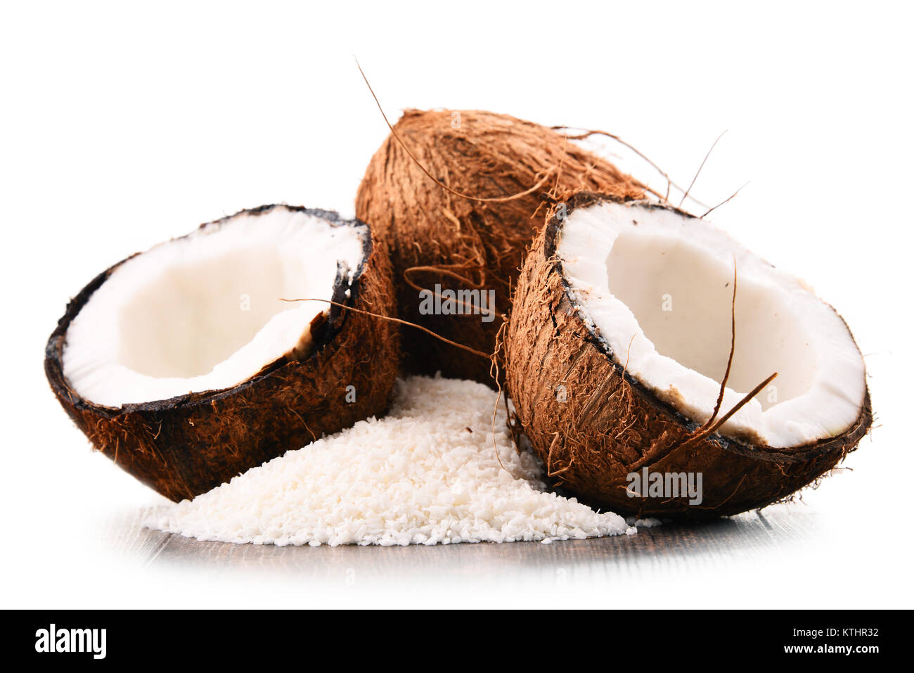 Composition with shredded coconut and shells isolated on white ...