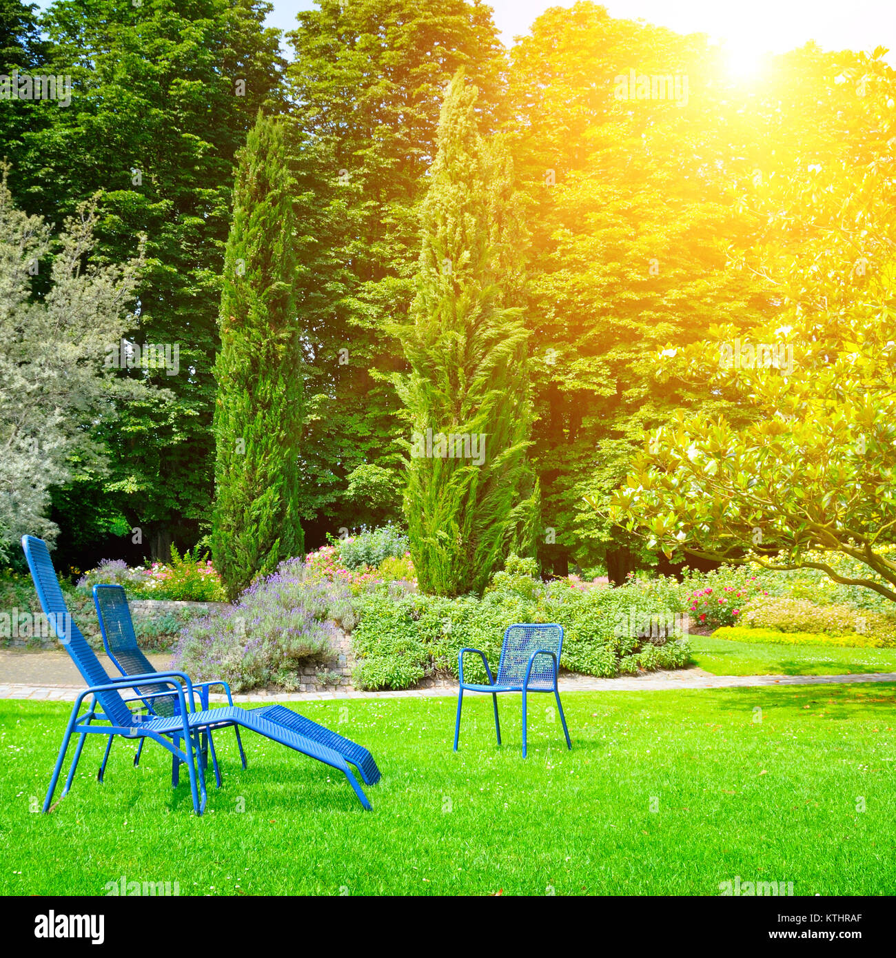 beautiful summer park with lawn and recliner Stock Photo - Alamy