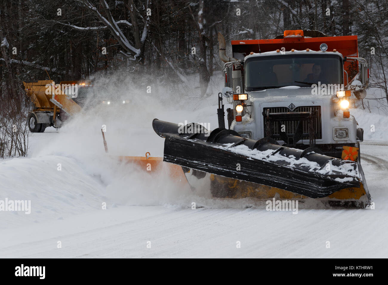 Snow plow clearing rural road in Quebec, Canada Stock Photo - Alamy