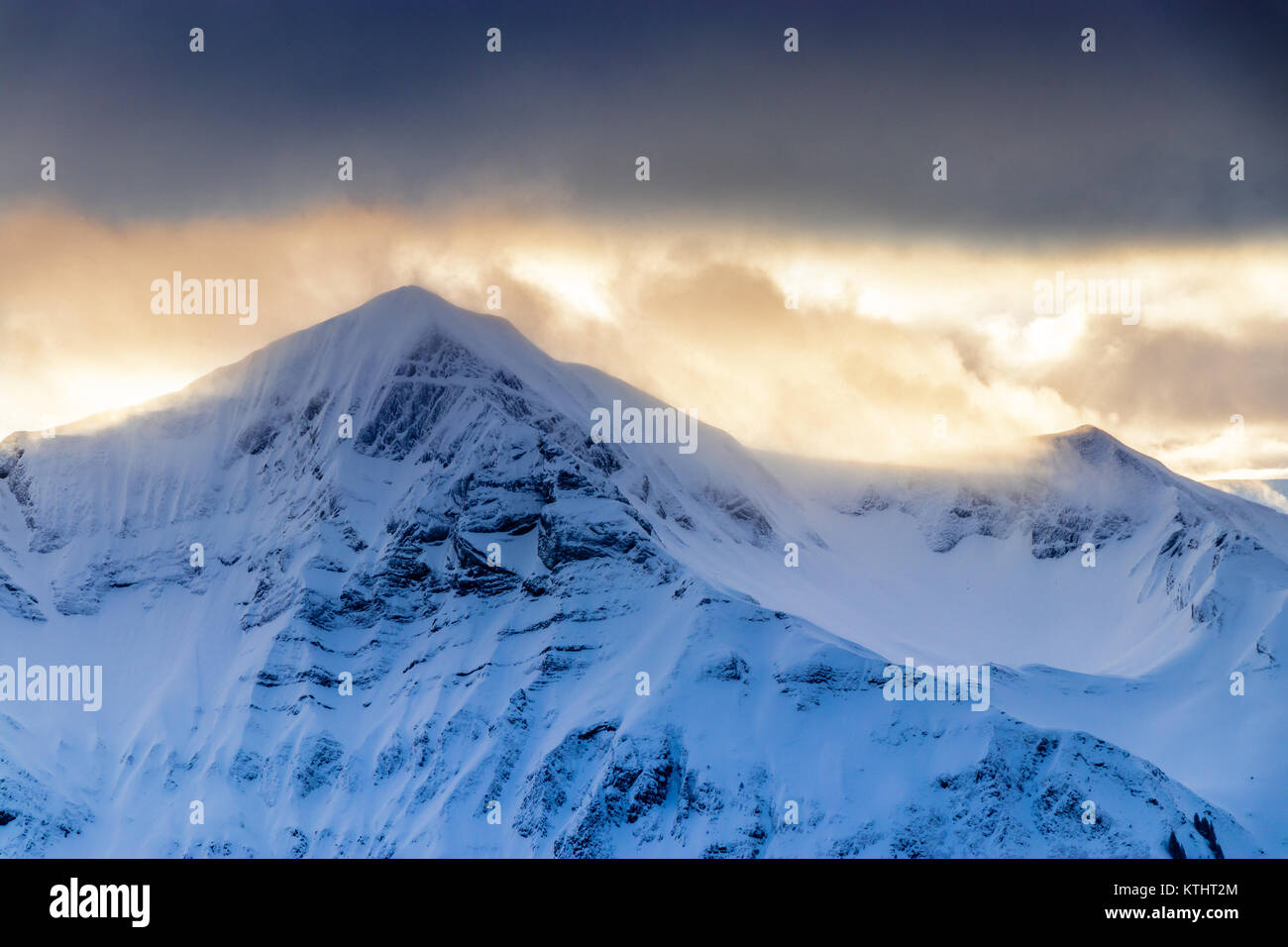 Early morning sun breaking through over a fantastic mountain landscape ...