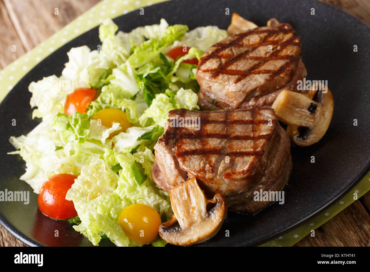 Roasted fillet mignon steak with fried mushrooms and fresh vegetable ...