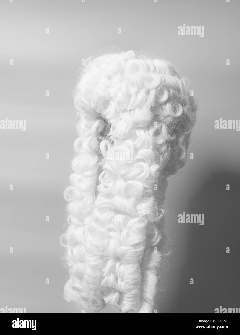 Judge wig on a gray background Stock Photo - Alamy