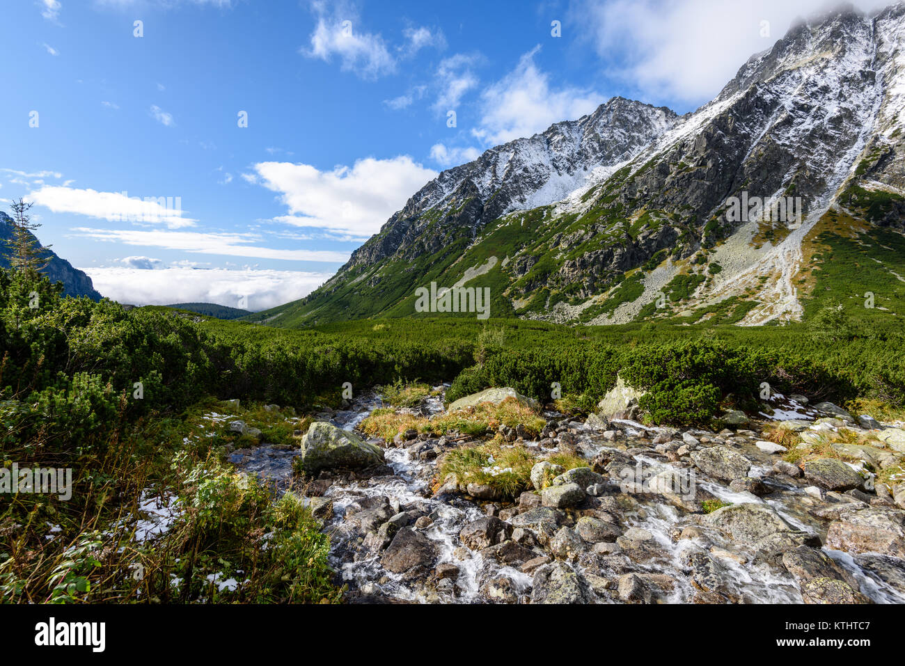 large Waterfall from ravine in autumn, long exposure, in mountain river ...