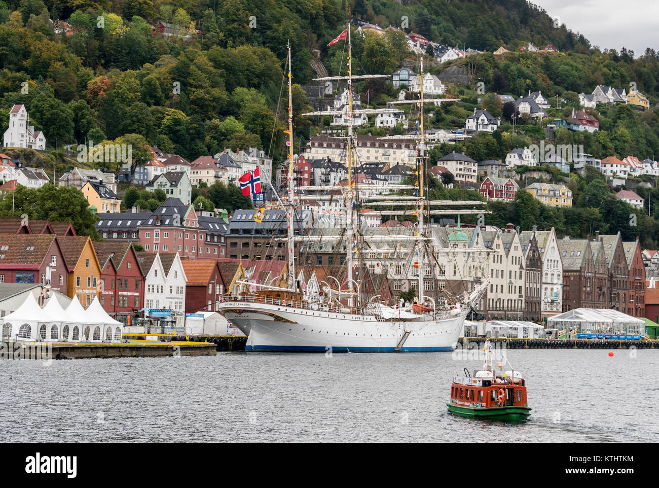 Small passenger ferry approaches dockside Stock Photo - Alamy