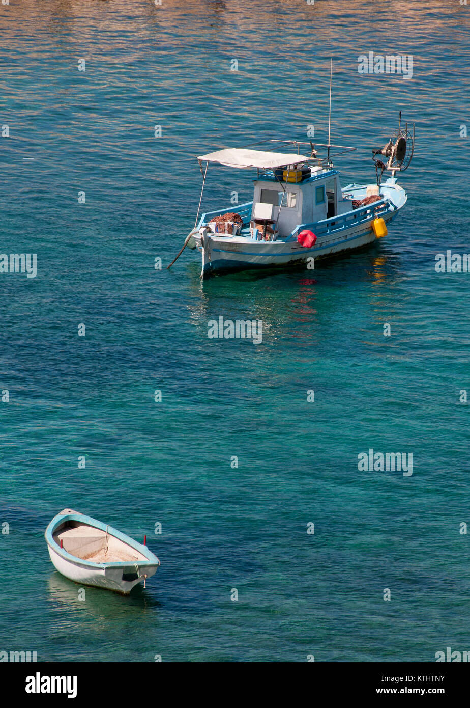 Small fishing boats floating at the sea at Akamas peninsula area in ...