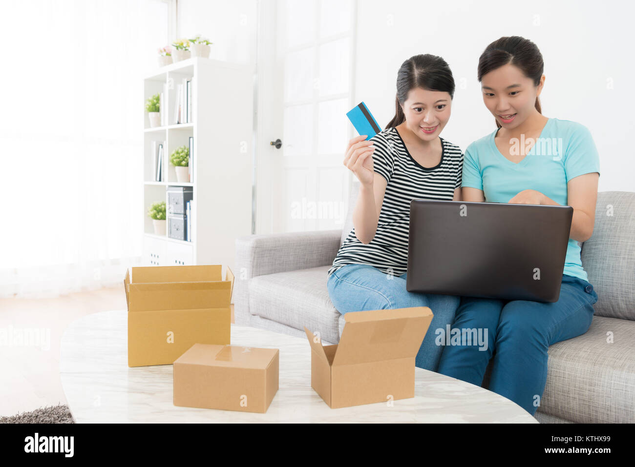 elegant beauty girls choosing online shopping goods through mobile ...