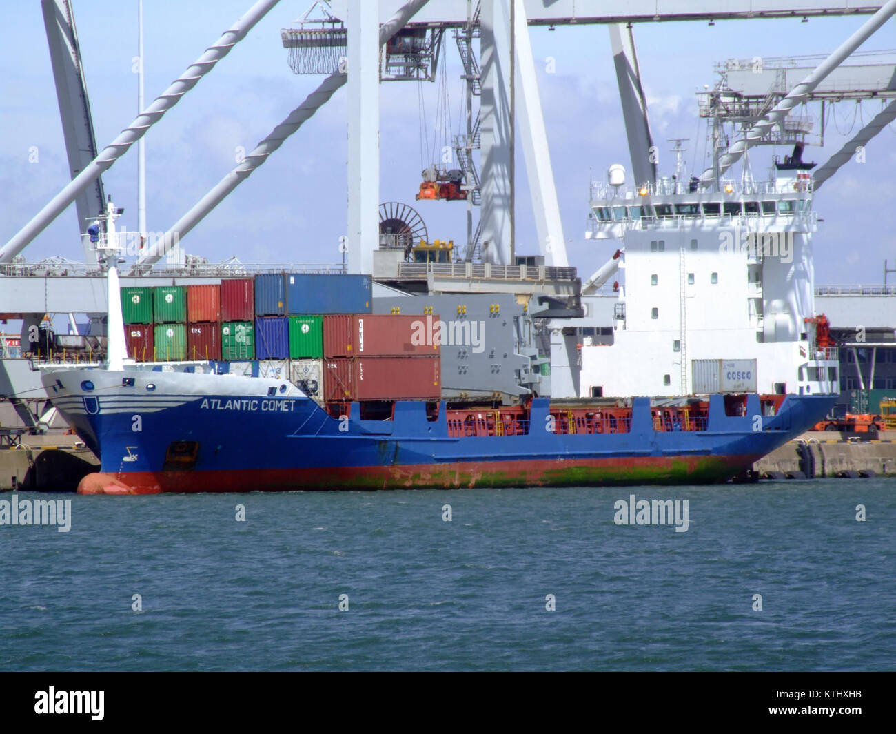 The Atlantic Comet, a cargo ship, is seen loading and unloading goods ...