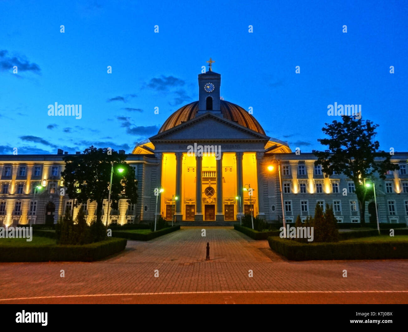 The image captures the Basilica in Bdg, Poland, illuminated at night on ...