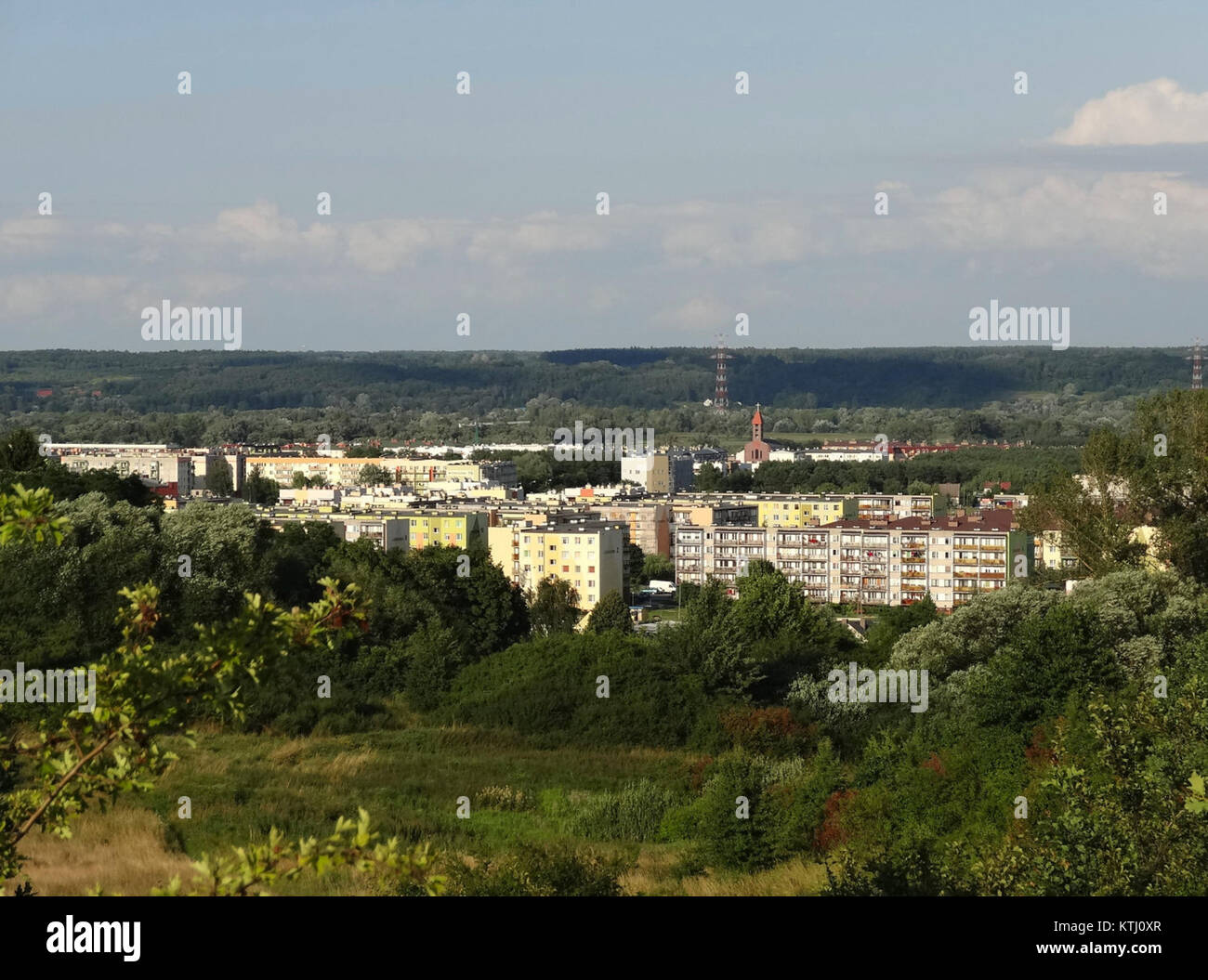 This image captures a view of a building with a street scene, likely ...
