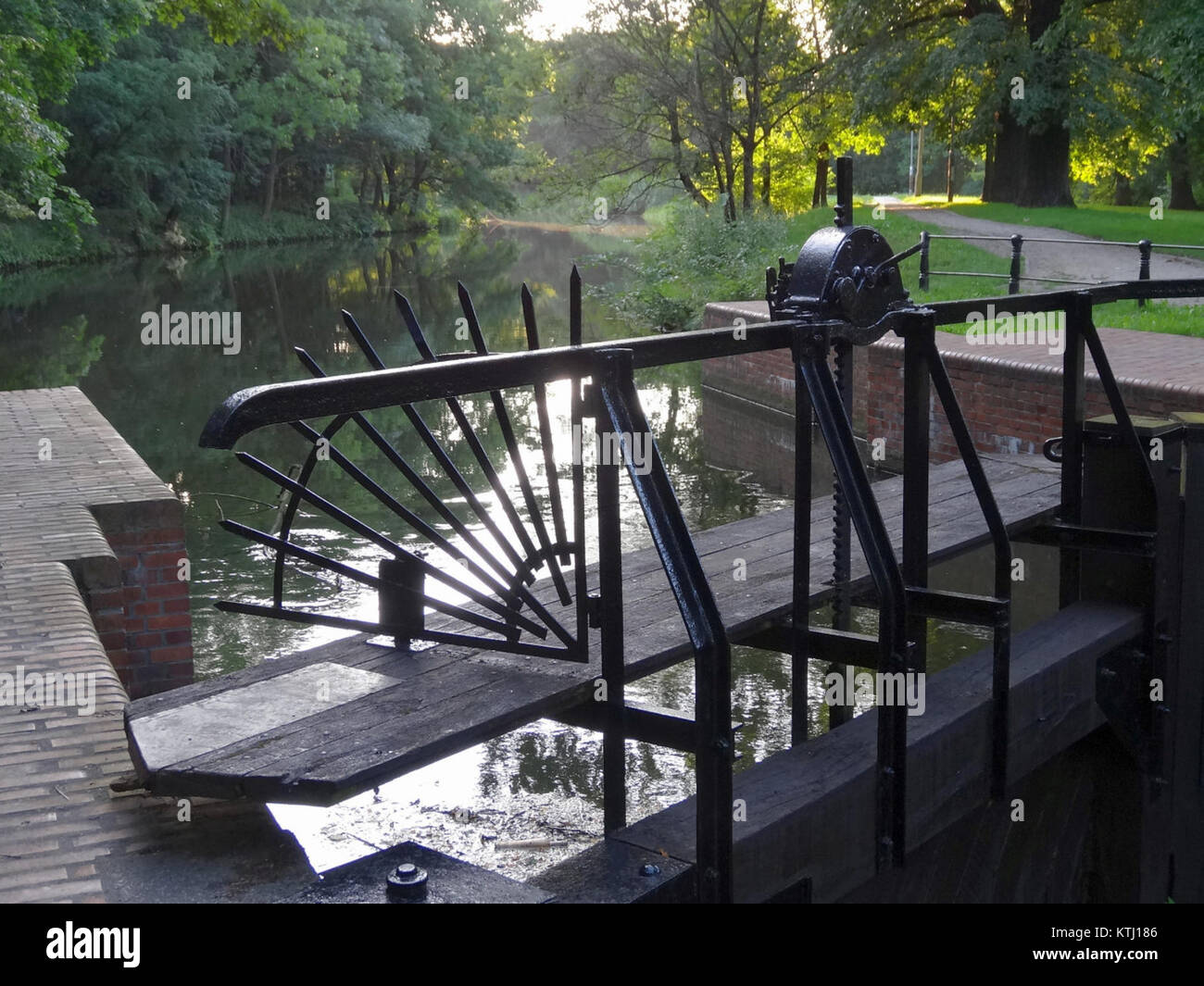The image depicts a sluice gate from a specific site, photographed on ...
