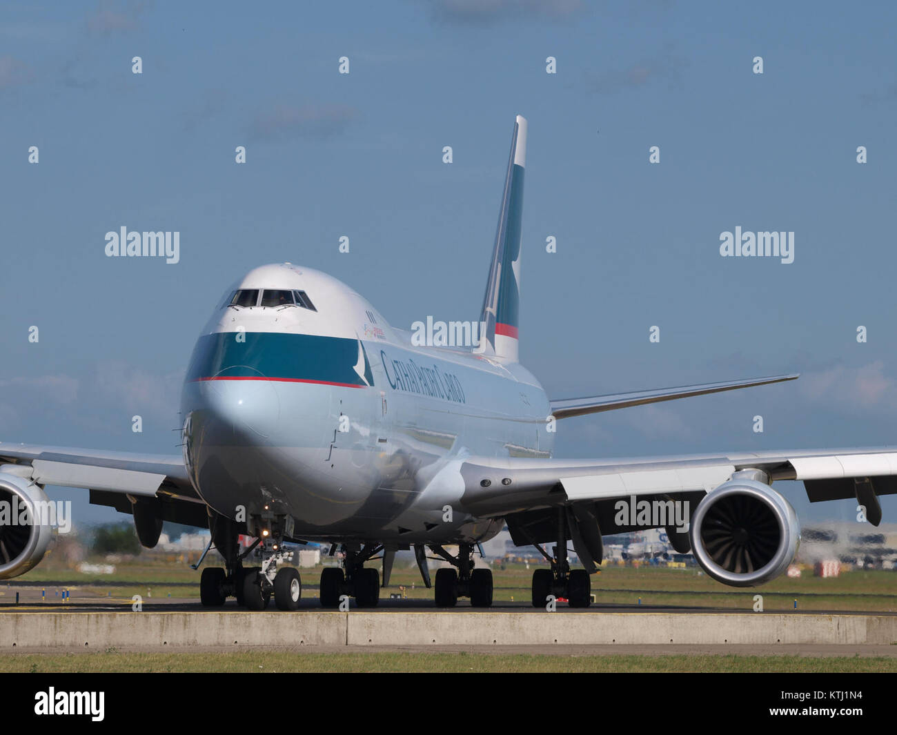 The image shows a Cathay Pacific Boeing 747 867F aircraft with ...