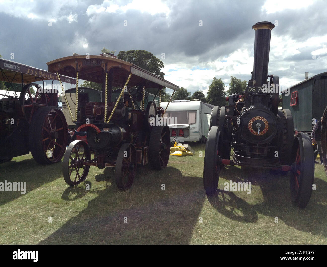 This image features two historical traction engines: the Aveling ...