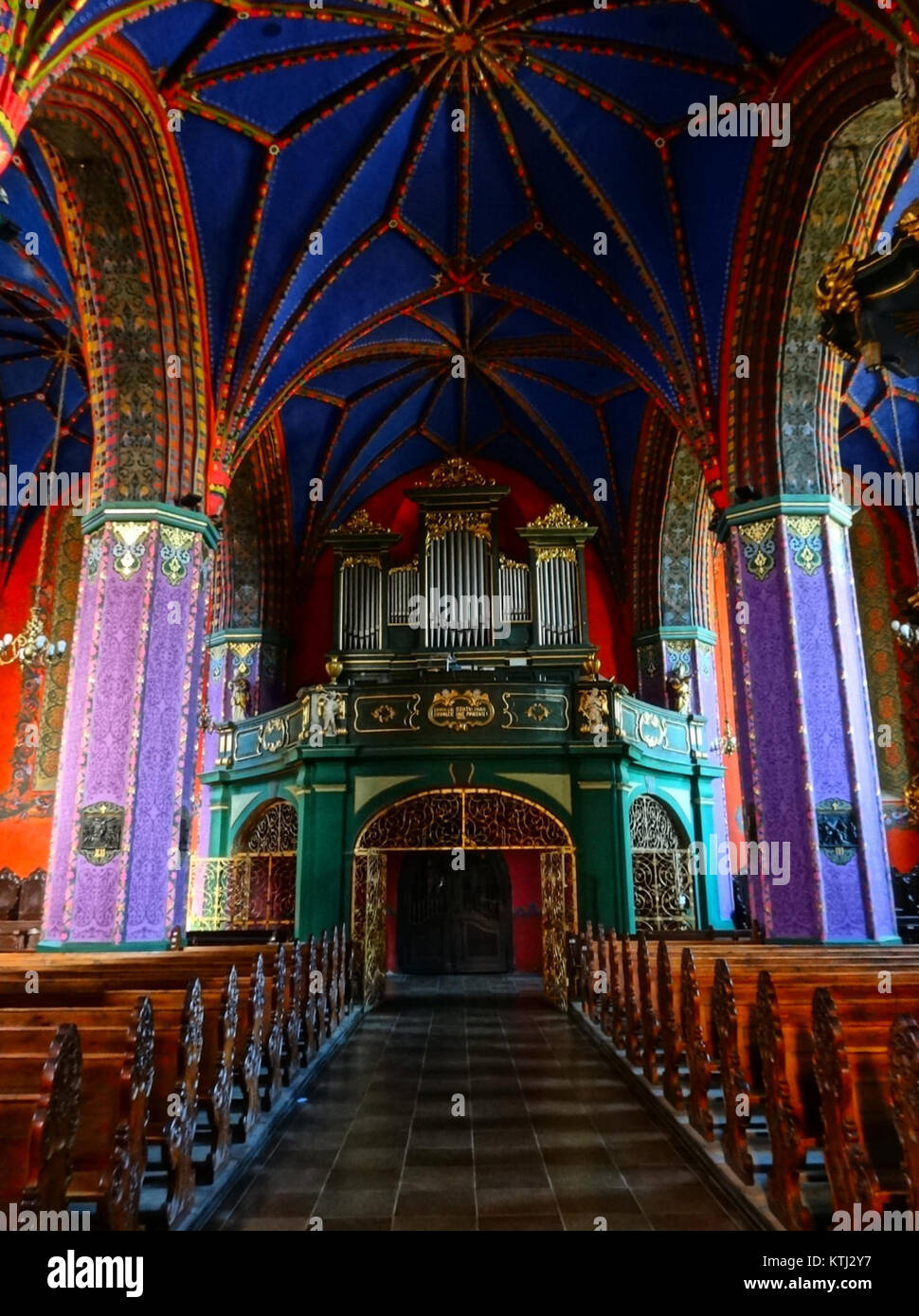 This photograph shows the interior of a cathedral nave, captured on ...