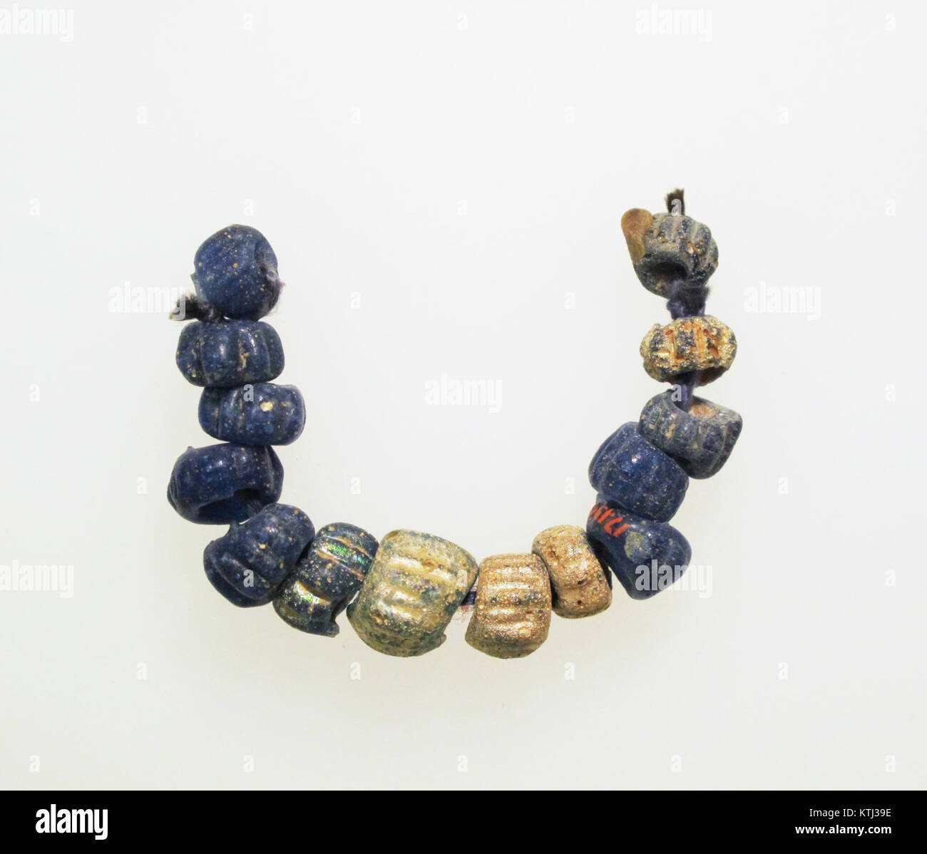 A collection of colorful beads, identified by the catalog number 14 MET ...