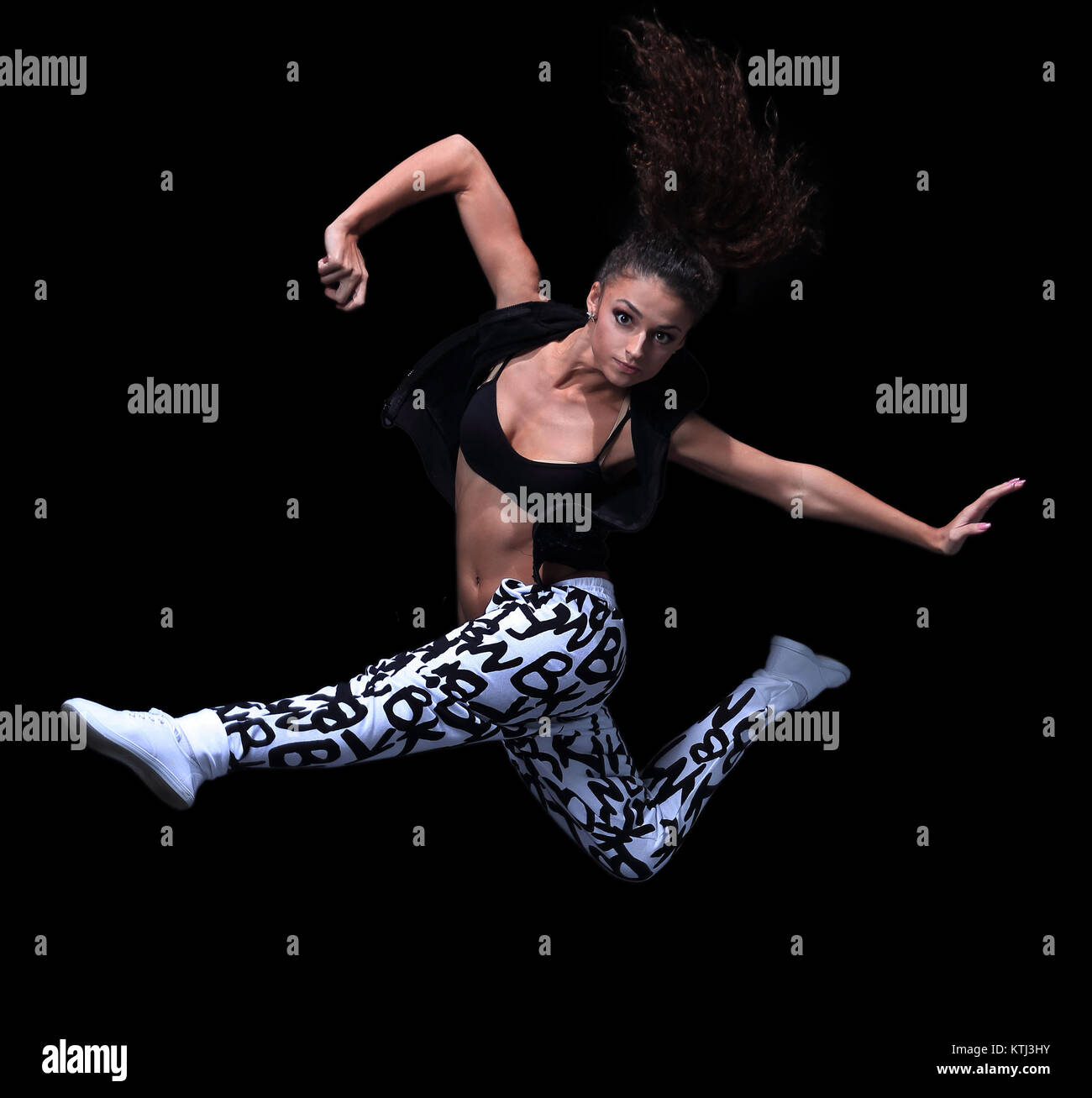 Girl jumping in hip hop style Stock Photo - Alamy