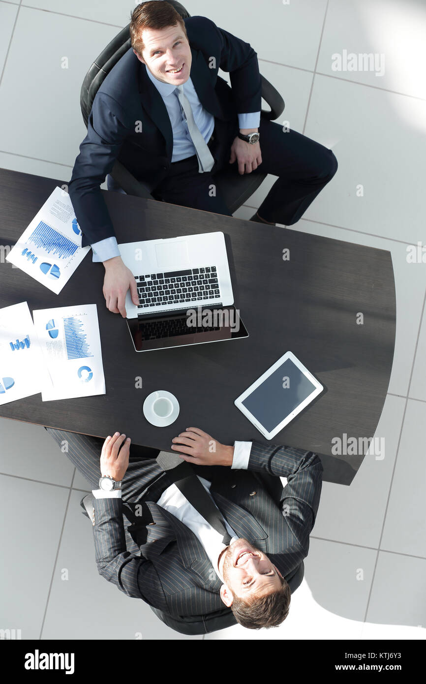 view from the top.business partners discussing the terms of a financial ...