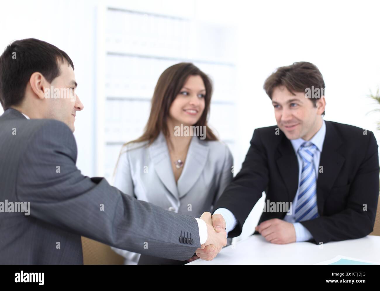 handshake business partners in the workplace Stock Photo - Alamy