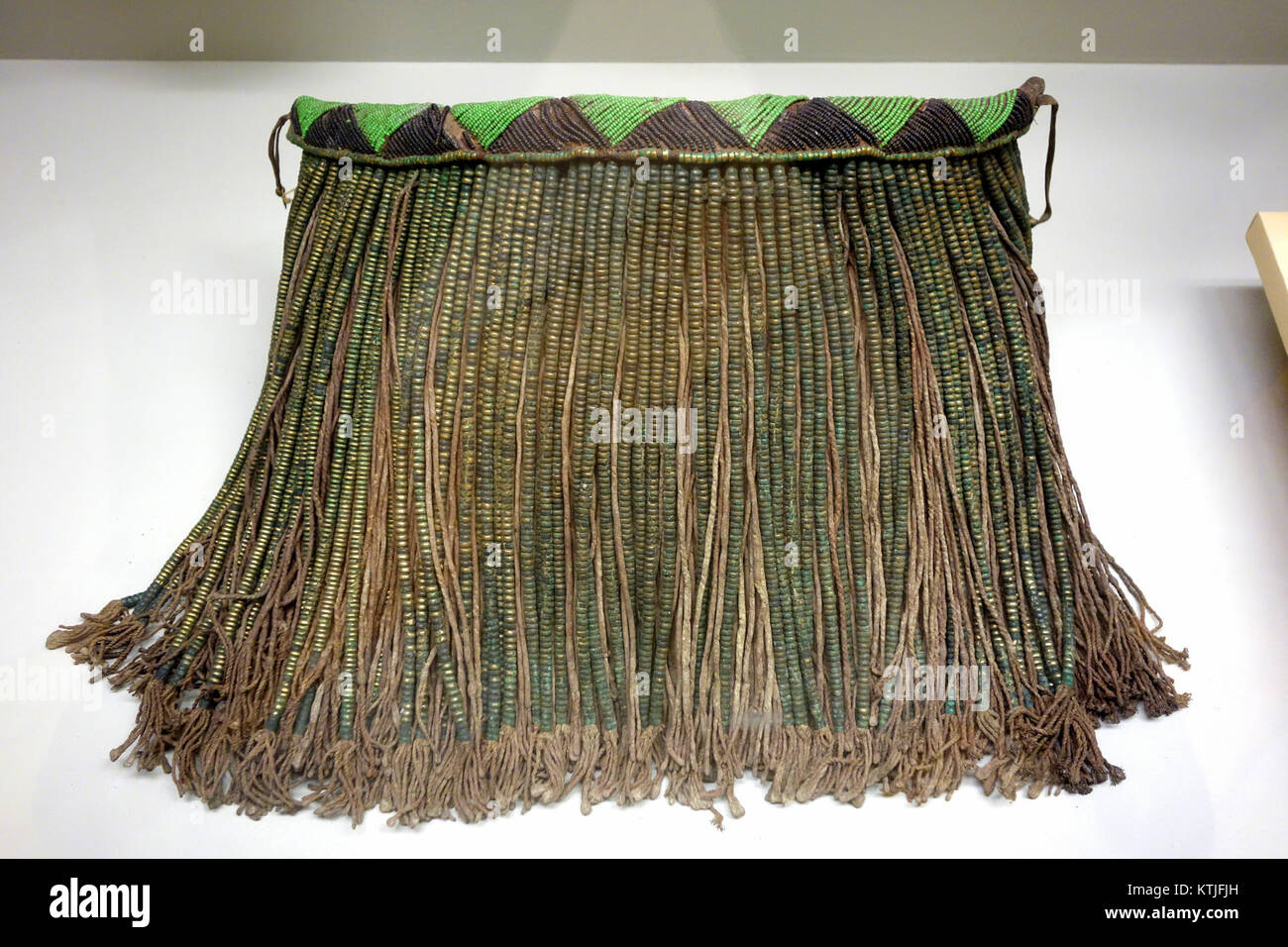 This Zulu belt with fringe and beads is a traditional piece of attire ...