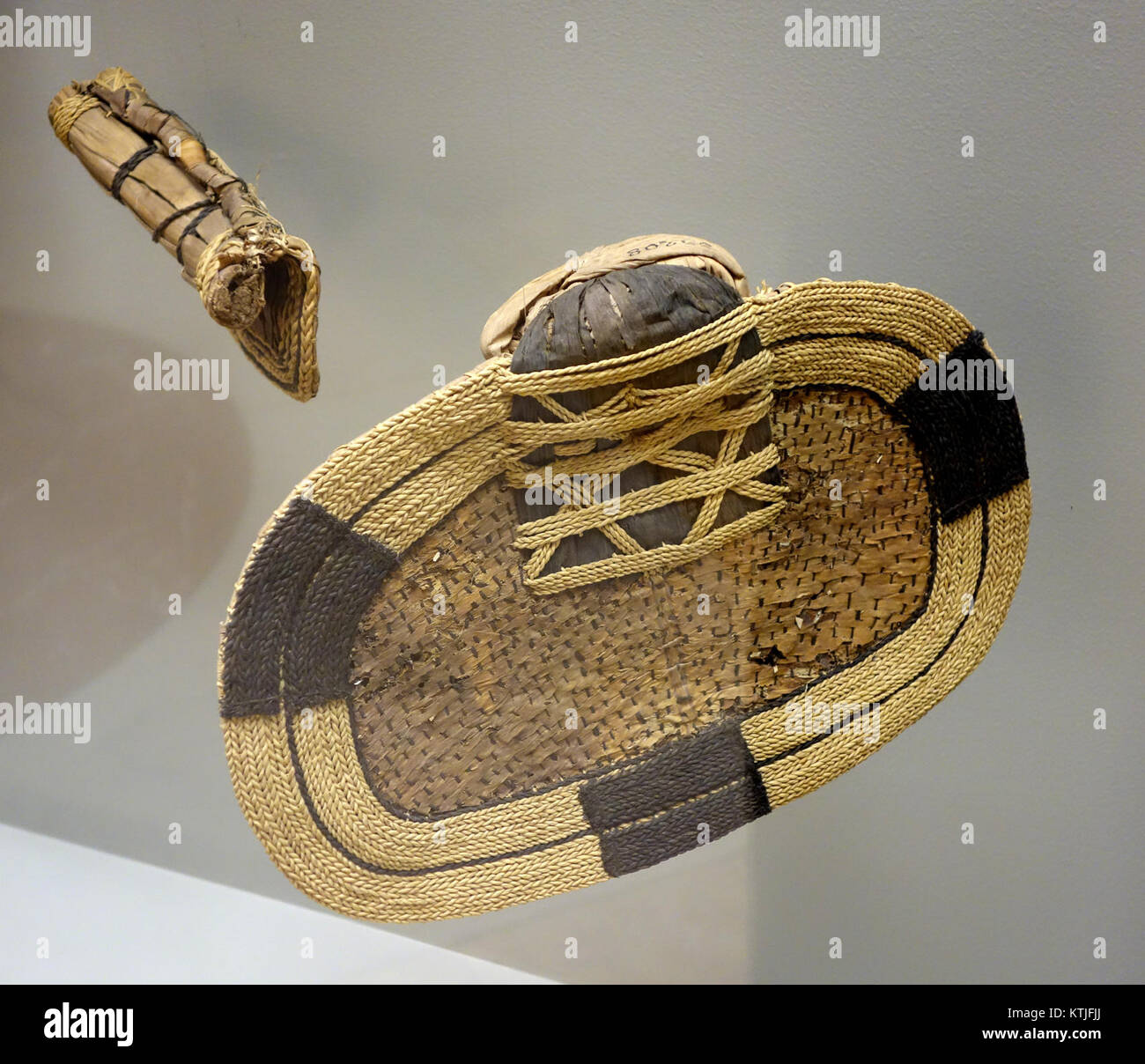 This image depicts belt ornaments from the Mangbetu people of Zaire ...