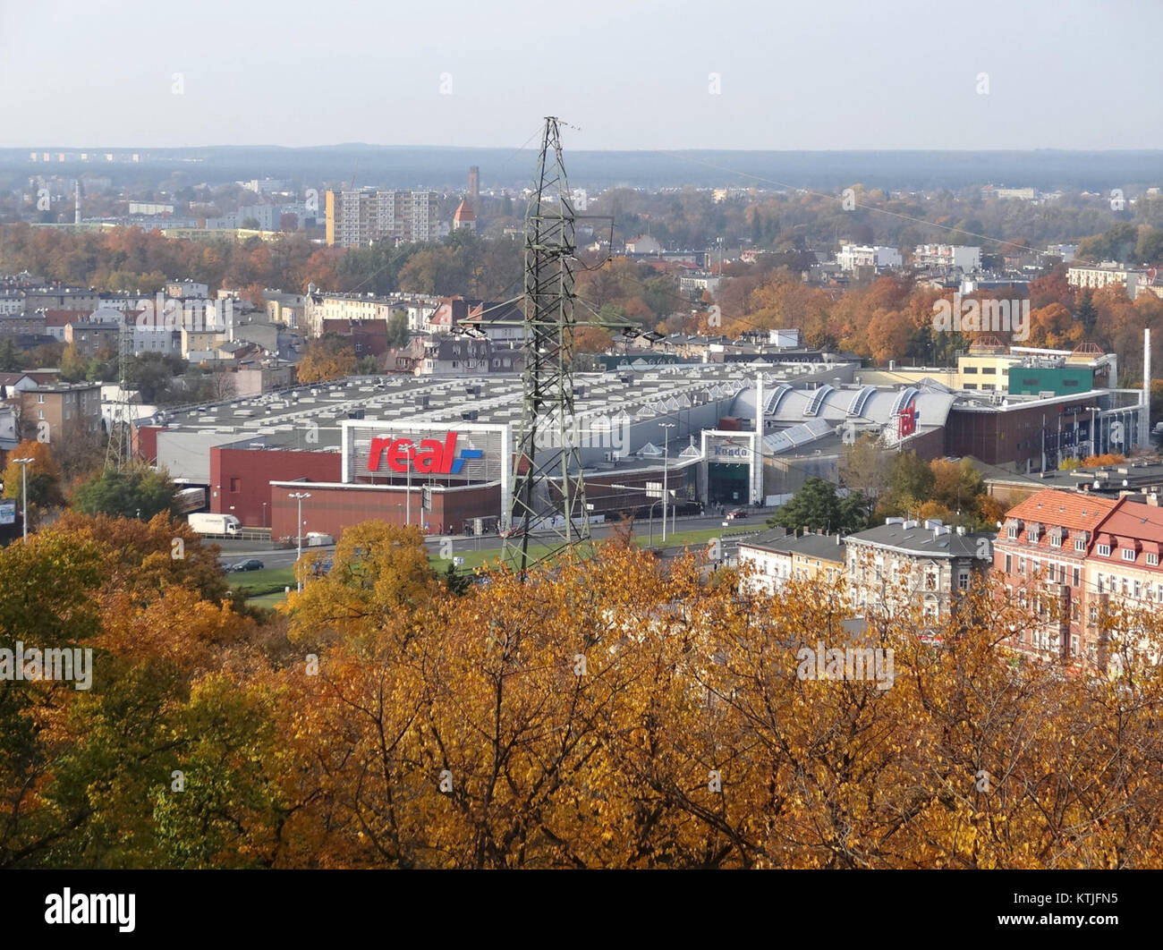 This image depicts a real estate building viewed from a compressed ...