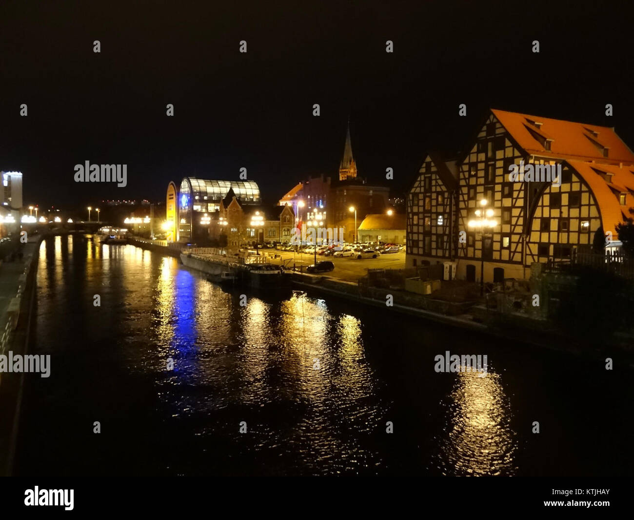 This image showcases a night view from a bridge in a city, taken on ...