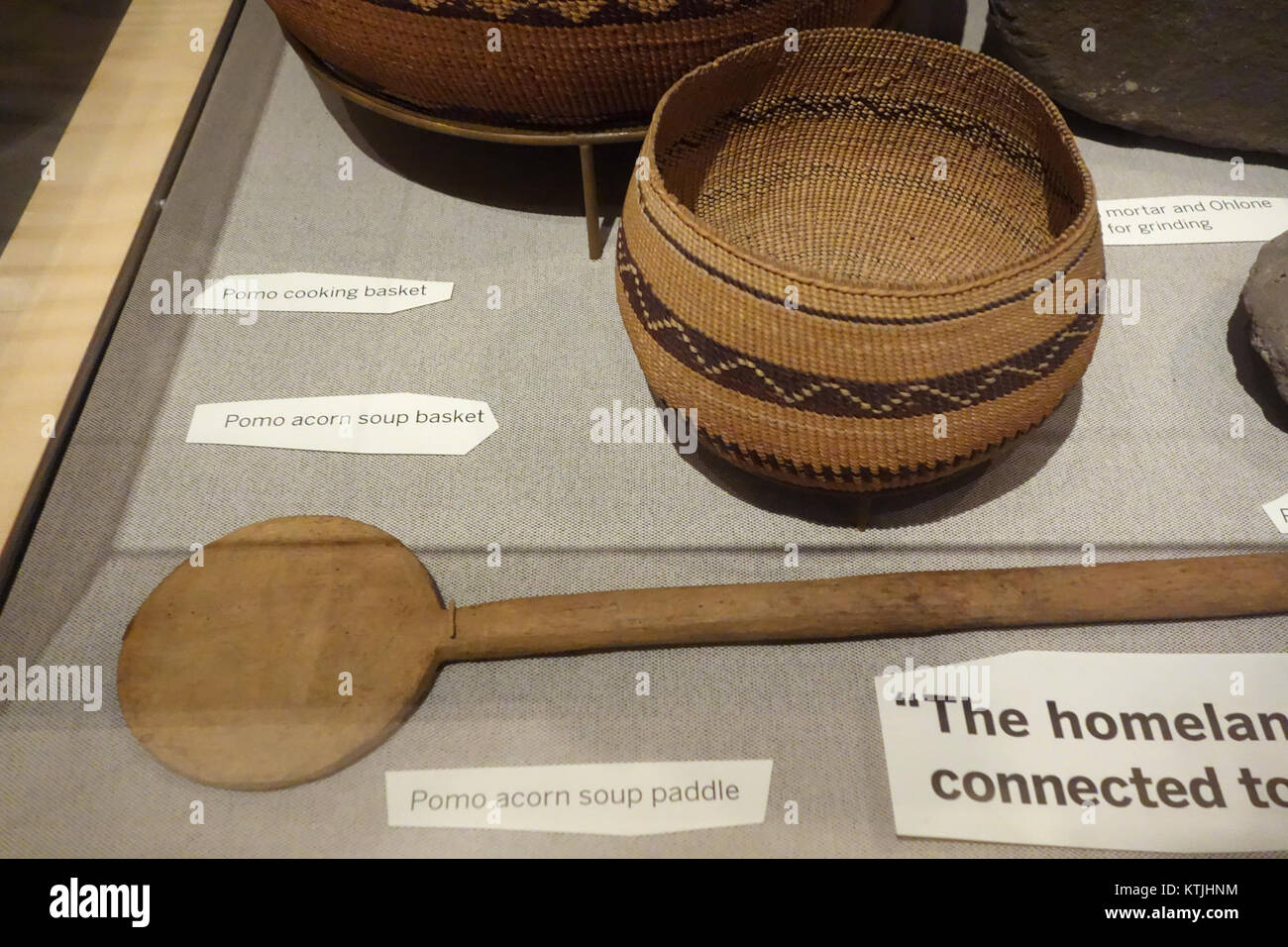 A basket and paddle used by the Pomo Native American tribe for making ...