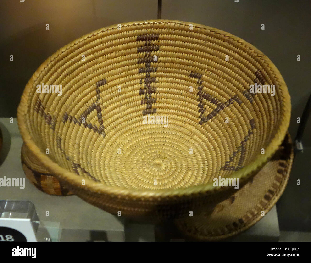 A handcrafted basket made by the Miwok people before 1917, housed in ...