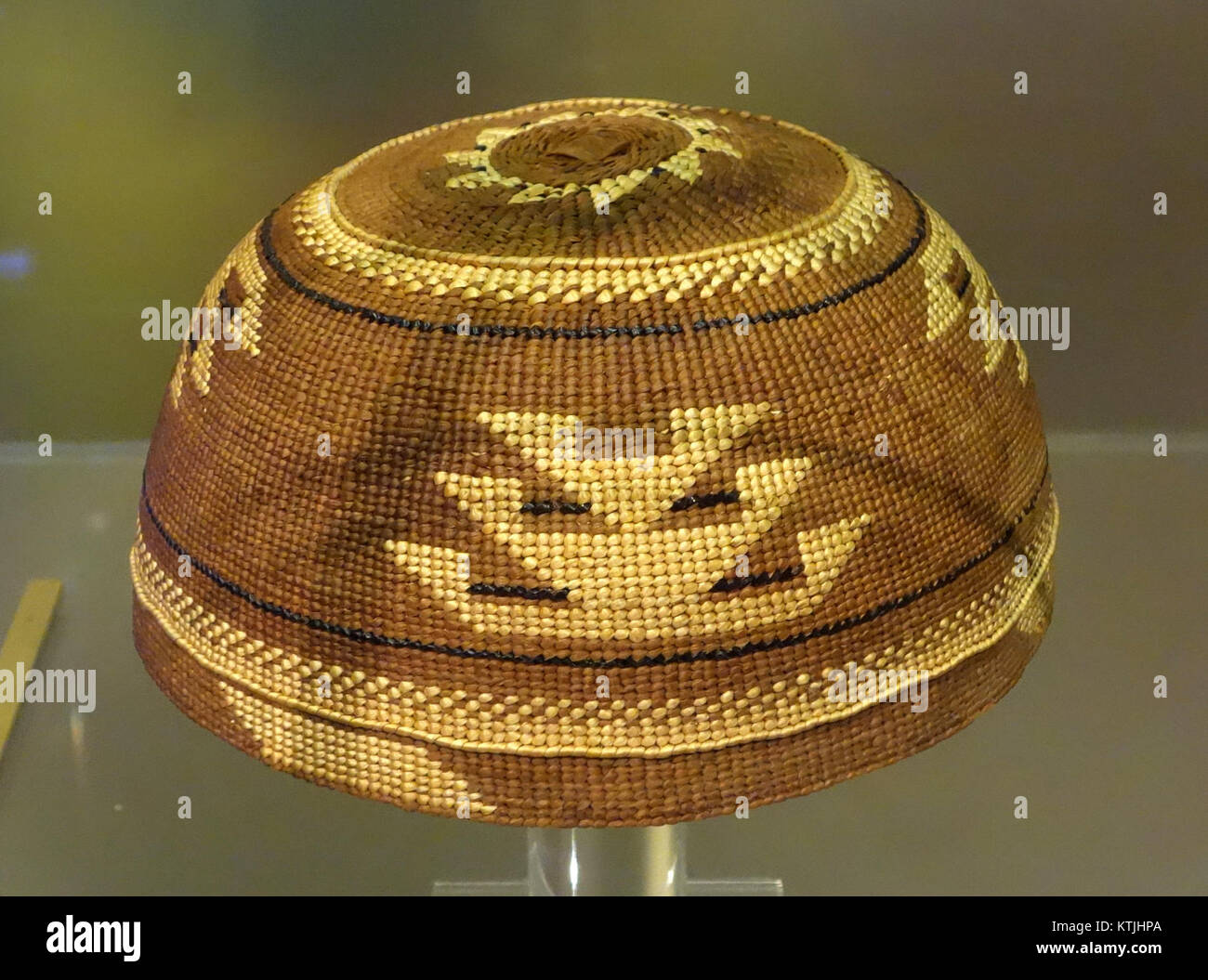 This basket hat, from the Klamath River area, is made using traditional ...