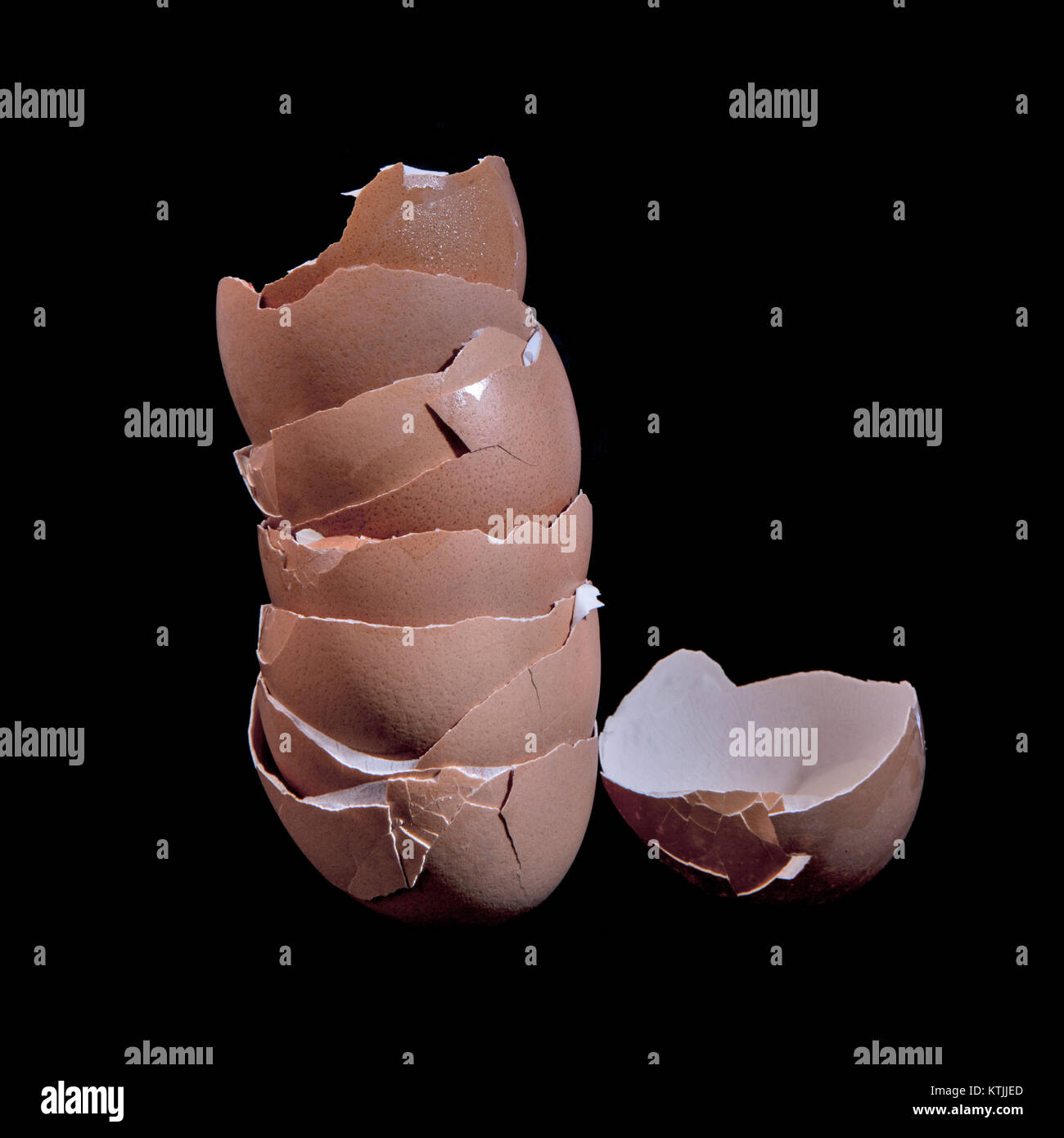Stack of broken egg shells on a black background Stock Photo - Alamy