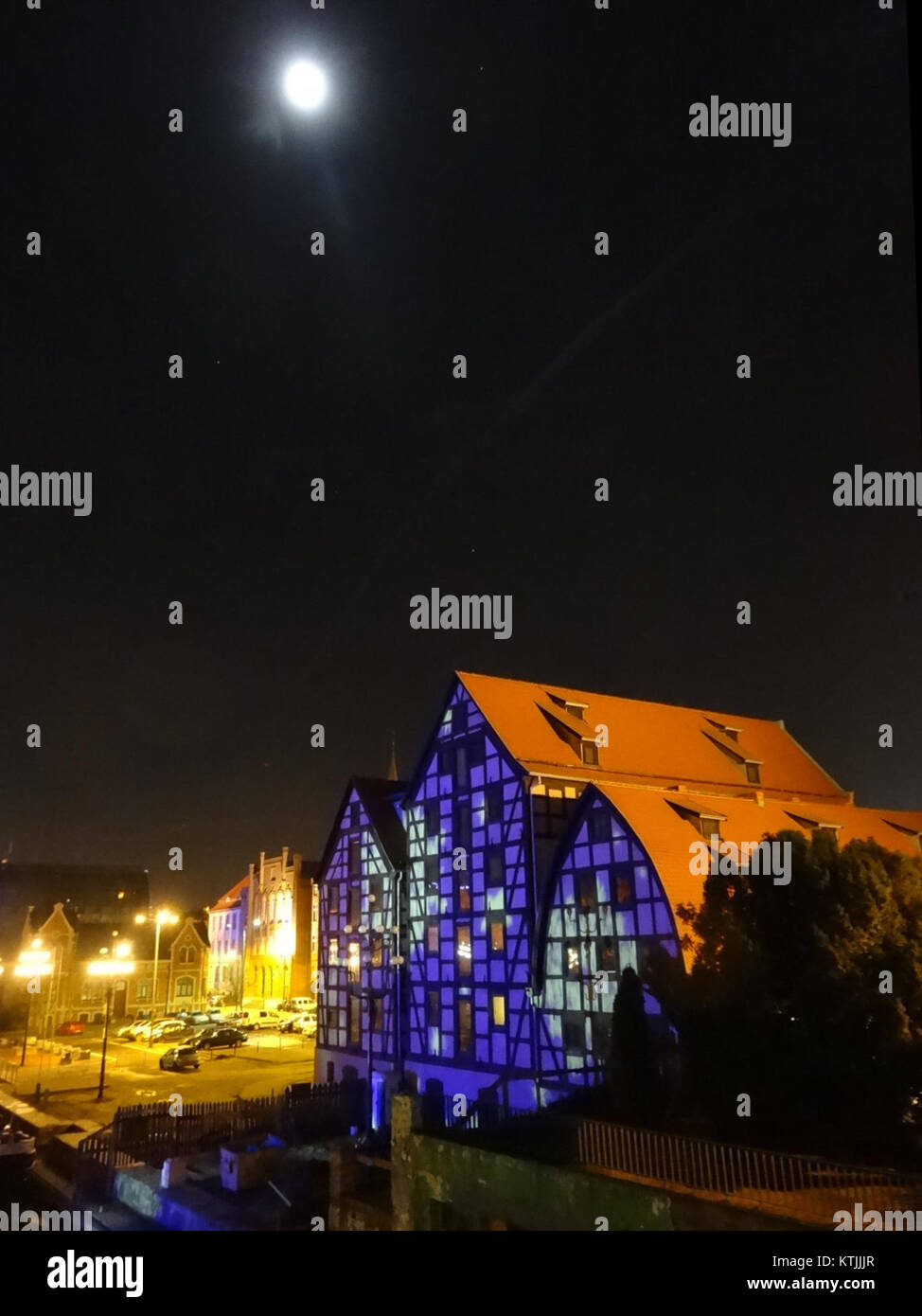 This image shows a historical granary building at night, photographed ...
