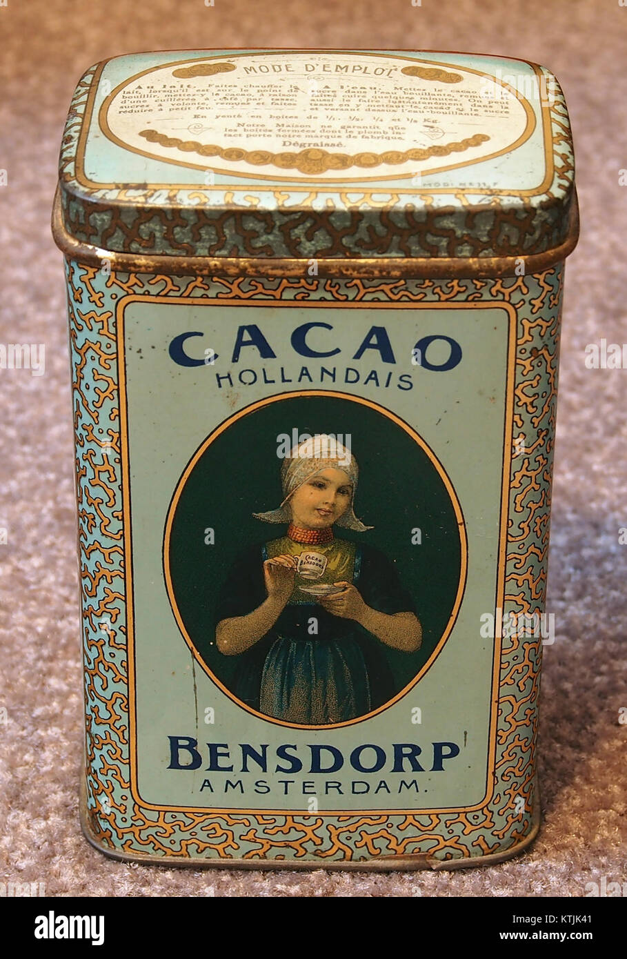 This image shows a vintage tin of Bensdorp Dutch cocoa, a well-known ...