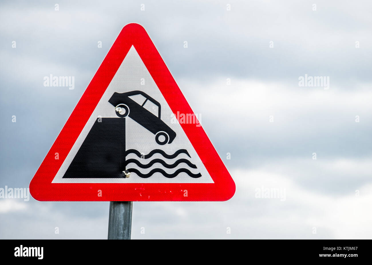 Sign warning of the Danger of falling into the water Stock Photo - Alamy