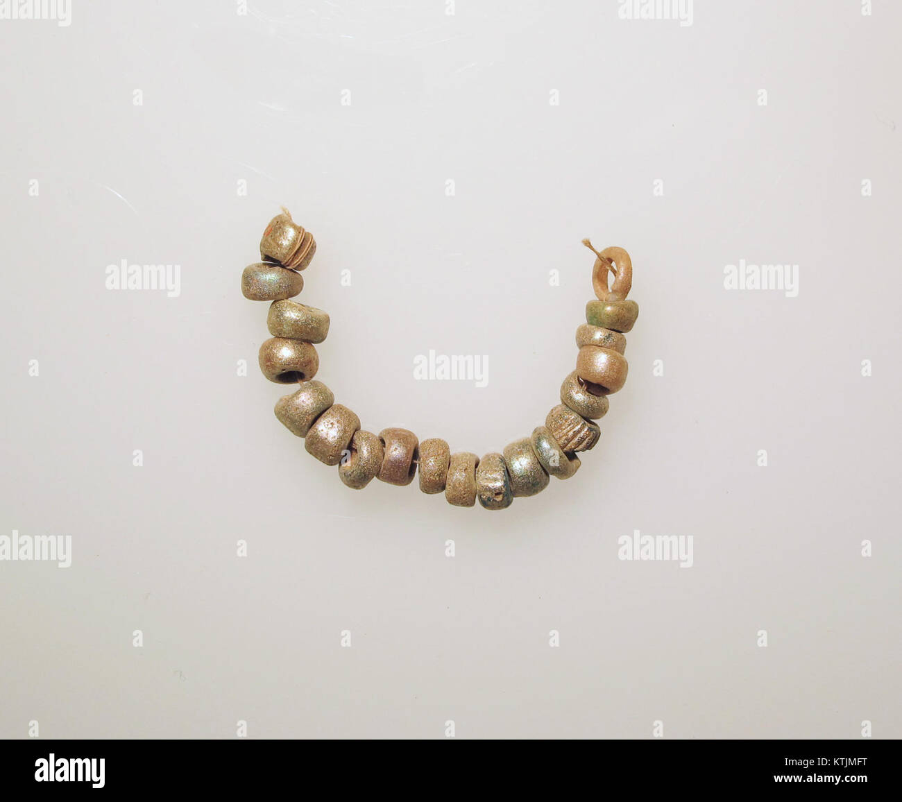 A collection of beads, cataloged as MET sf17194701color, represents a ...
