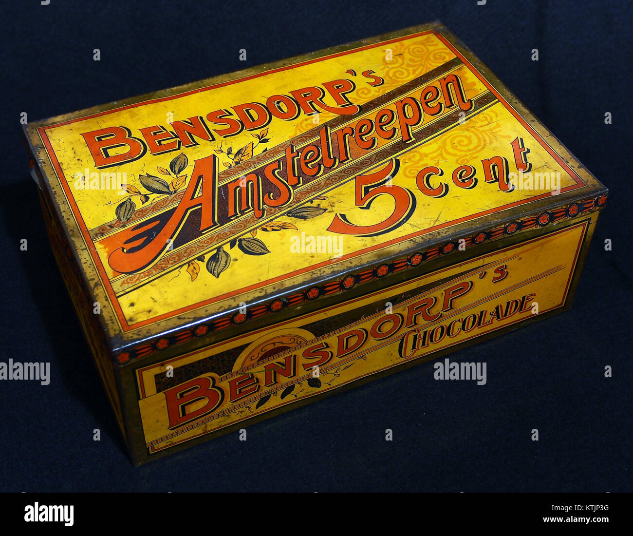 The *Bensdorps chocolade blik* is a yellow-colored chocolate tin, part ...