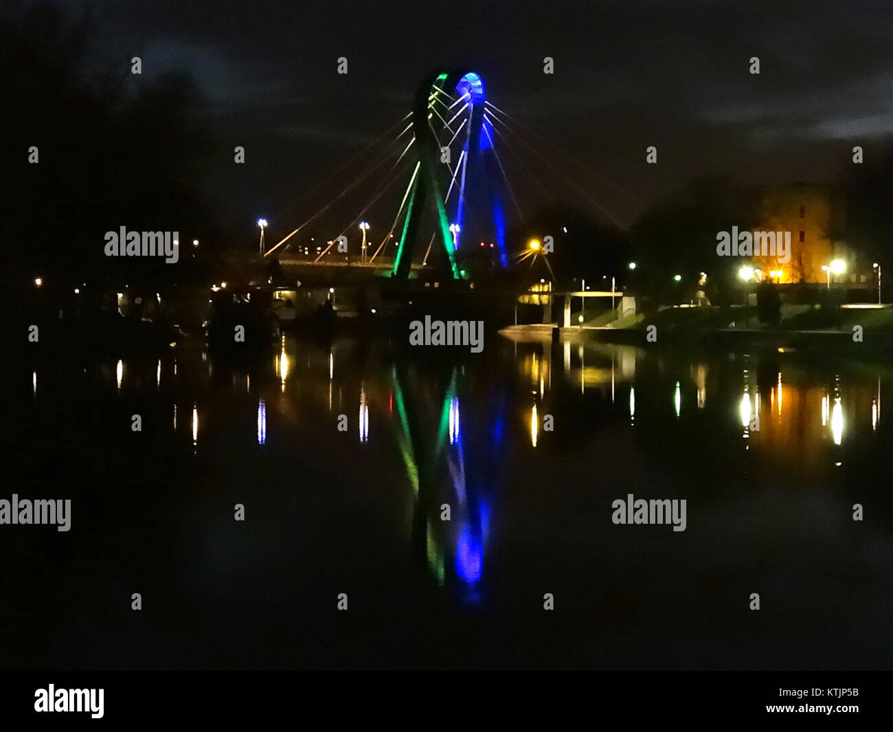 This image depicts a modern building with a prominent pylon structure ...