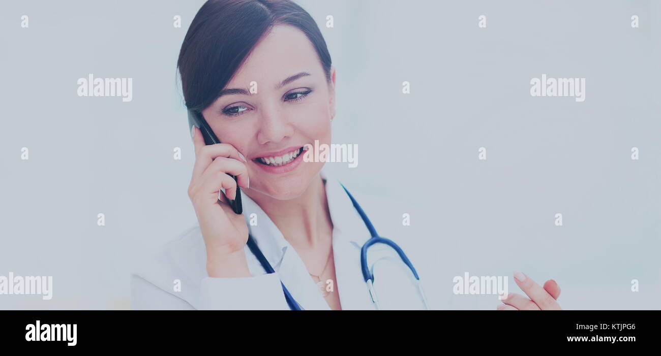 Doctor talking on telephone Stock Photo - Alamy