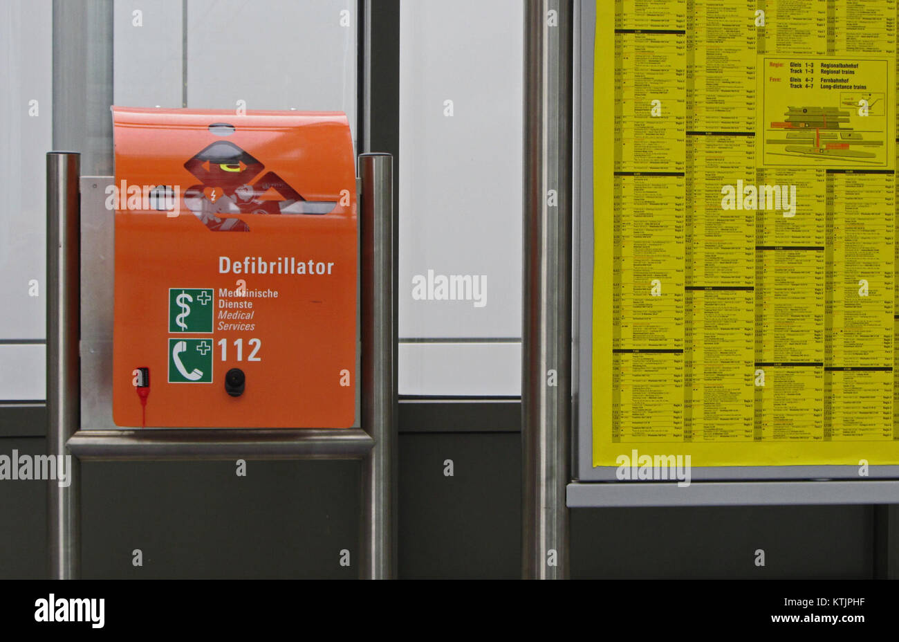 The image features an automated external defibrillator (AED) located at ...