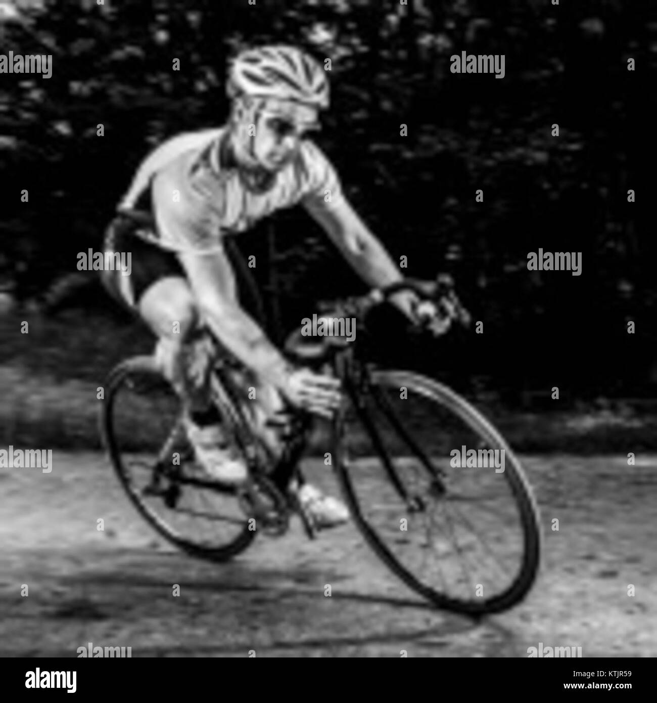 An athlete riding a bicycle in a competitive setting, showcasing speed ...