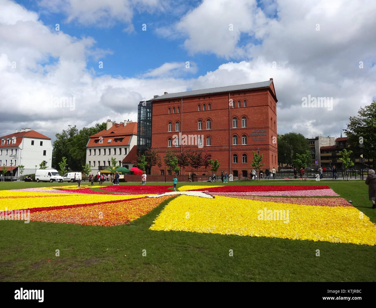 A photograph of a floral-patterned rug, or 'dywan' in Polish, possibly ...