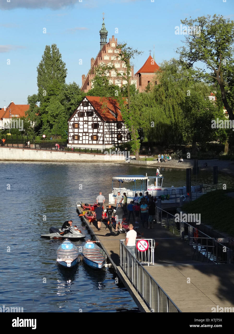 The photograph depicts a building, likely a harbor or port structure ...