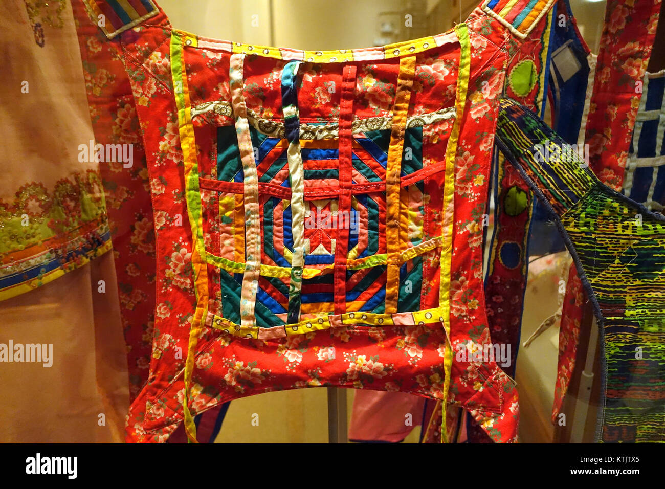 This baby carrier, displayed at the Hong Kong Museum of History, is a ...