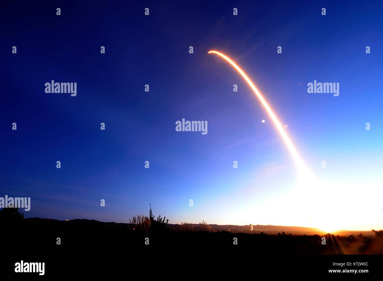 The SpaceX Falcon 9 rocket streaks across the night sky as it blasts ...
