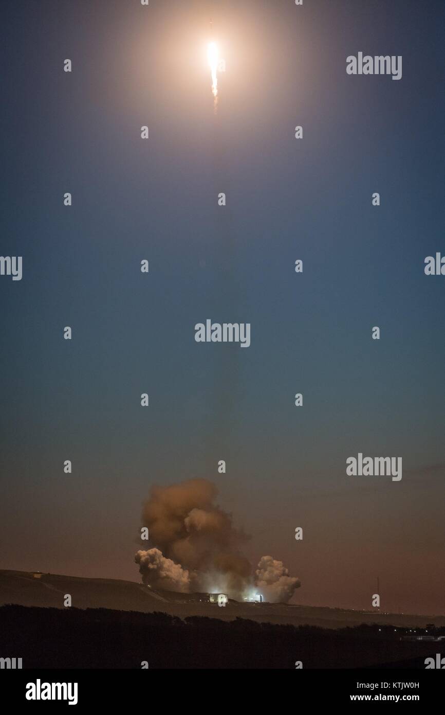 The SpaceX Falcon 9 rocket streaks across the night sky as it blasts ...