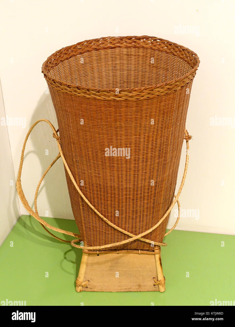 A woven basket with straps, part of an exhibit from the Vietnamese ...