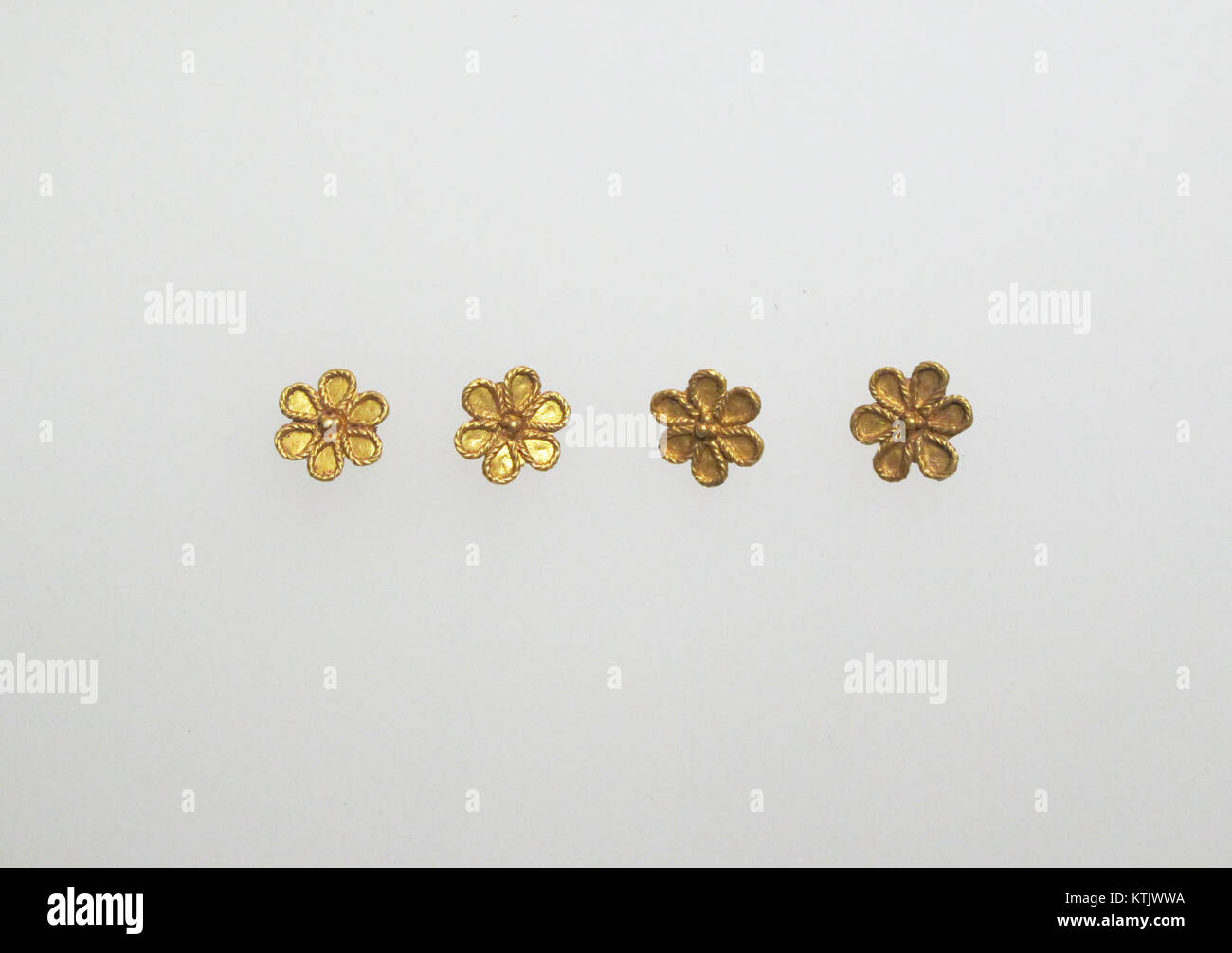 Bead ornaments with a rosette shape, cataloged as MET sf981191ad, are ...