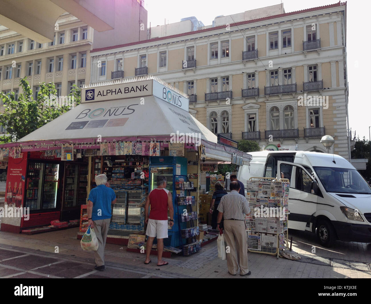 A historic image of a newspaper kiosk in Athens, reflecting the early ...