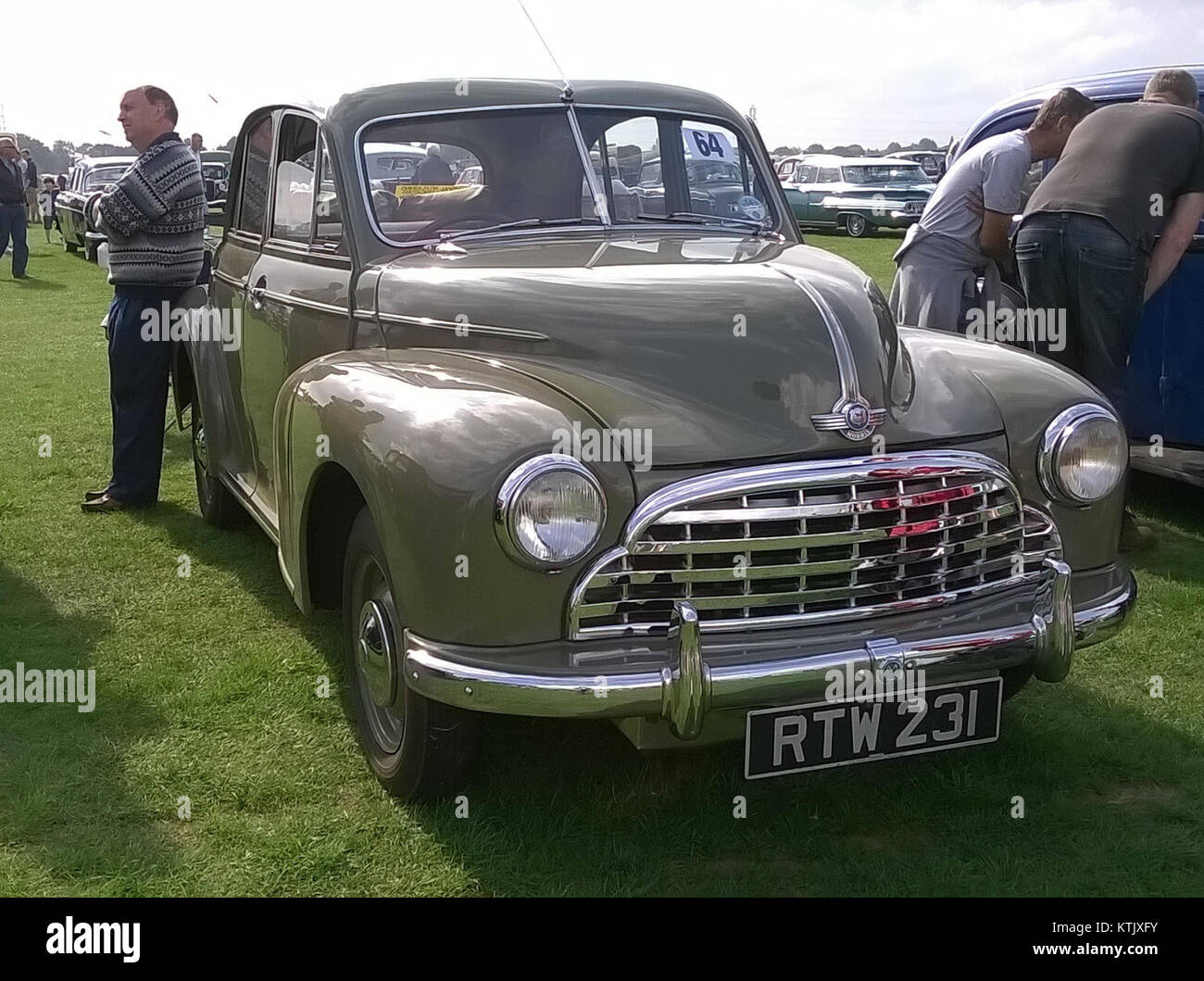 The image depicts an Austin Morris, a British car model known for its ...