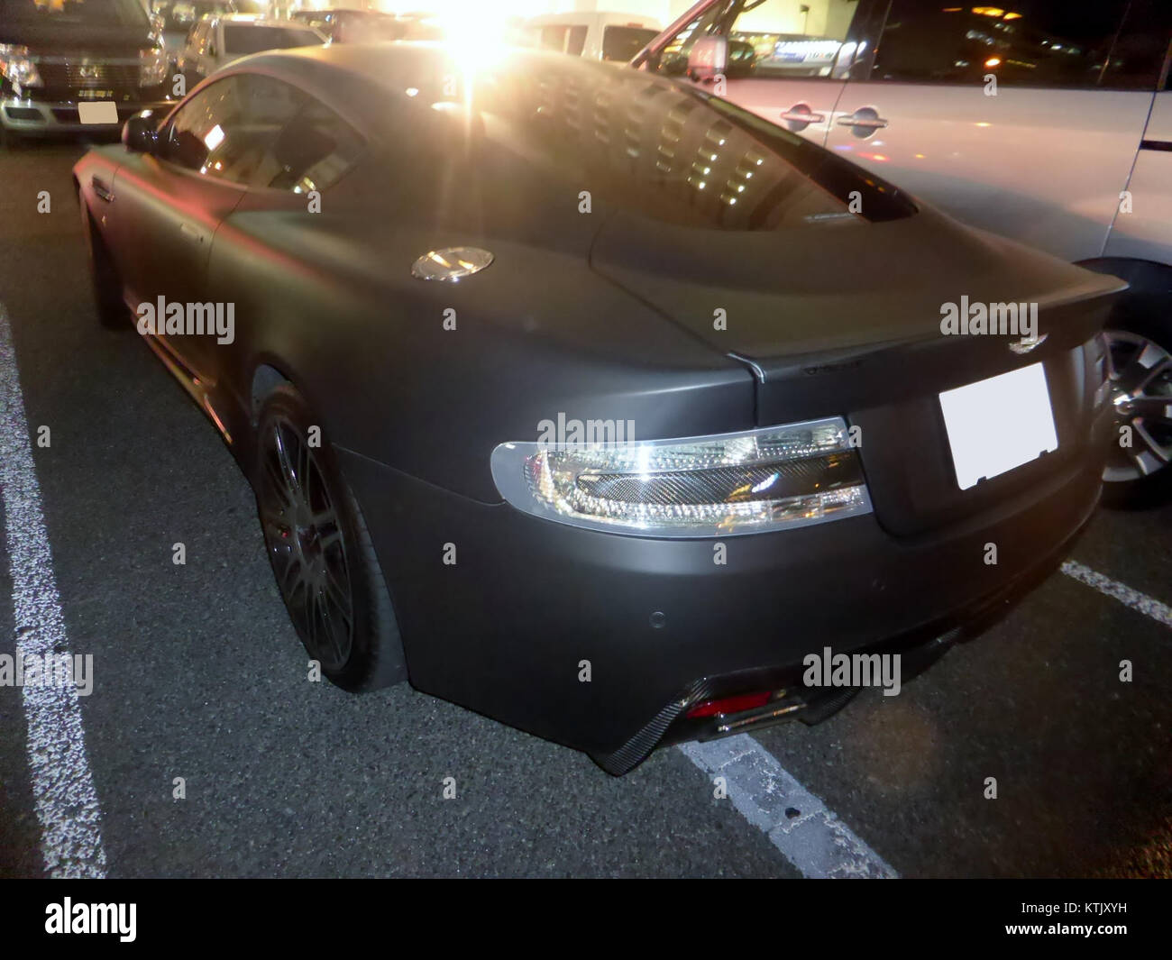 Aston Martin DB9 at night rear Stock Photo - Alamy