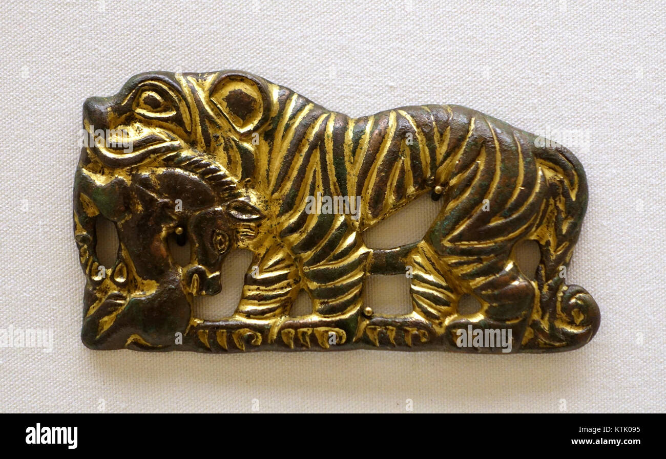 A pair of ancient gilt bronze belt plaques from the Ordos region ...