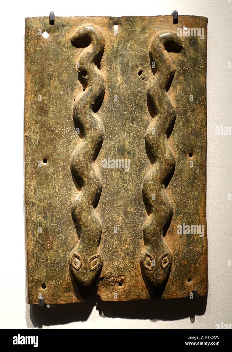 This Benin plaque, housed in the Ethnological Museum in Berlin, is an ...